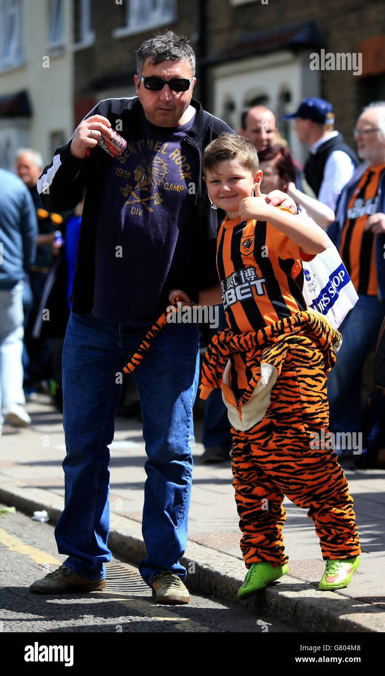 A young Hull City fan wearing his Tiger onesie smiles before the start ...