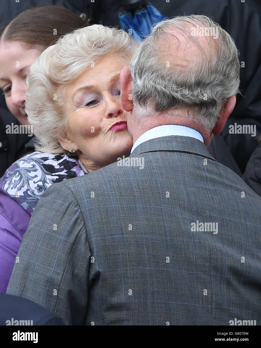EDS NOTE ALTERNATIVE CROP The Prince of Wales kisses Marie Conlon from ...