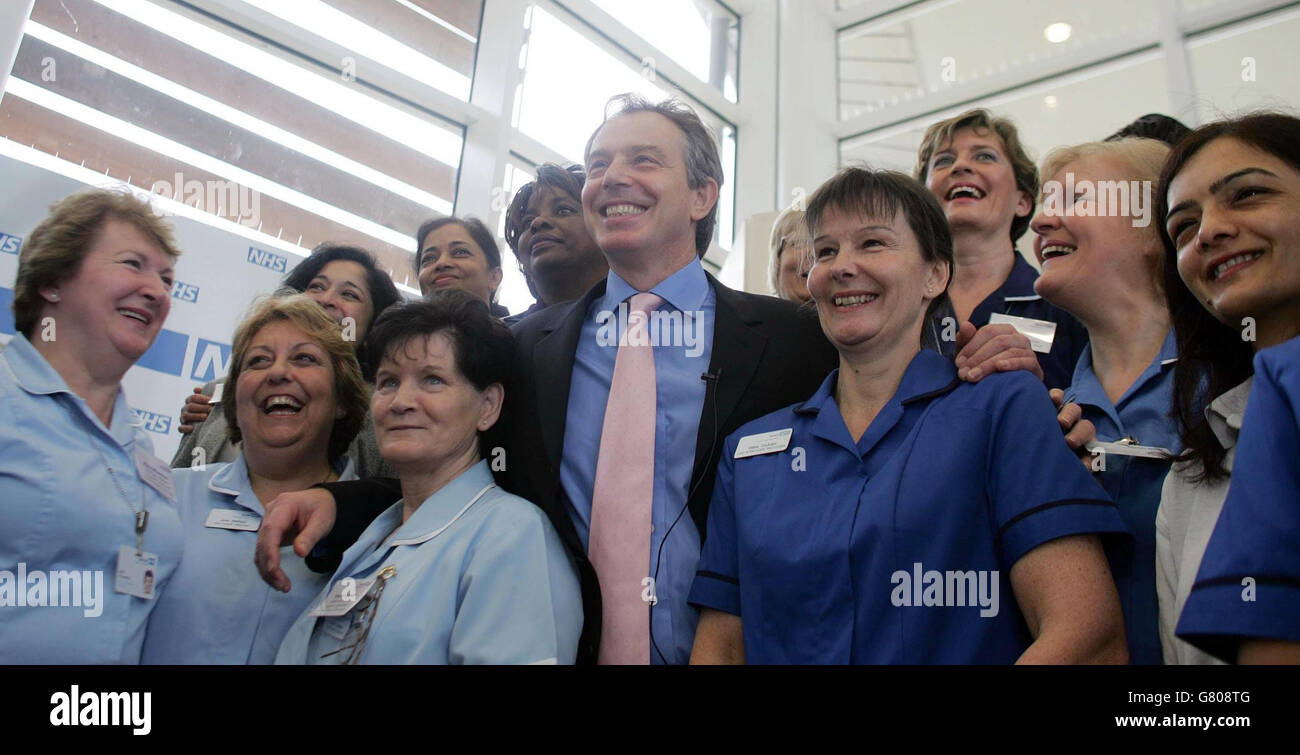 Britain's Prime Minister Tony Blair stands with hospital staff during a ...