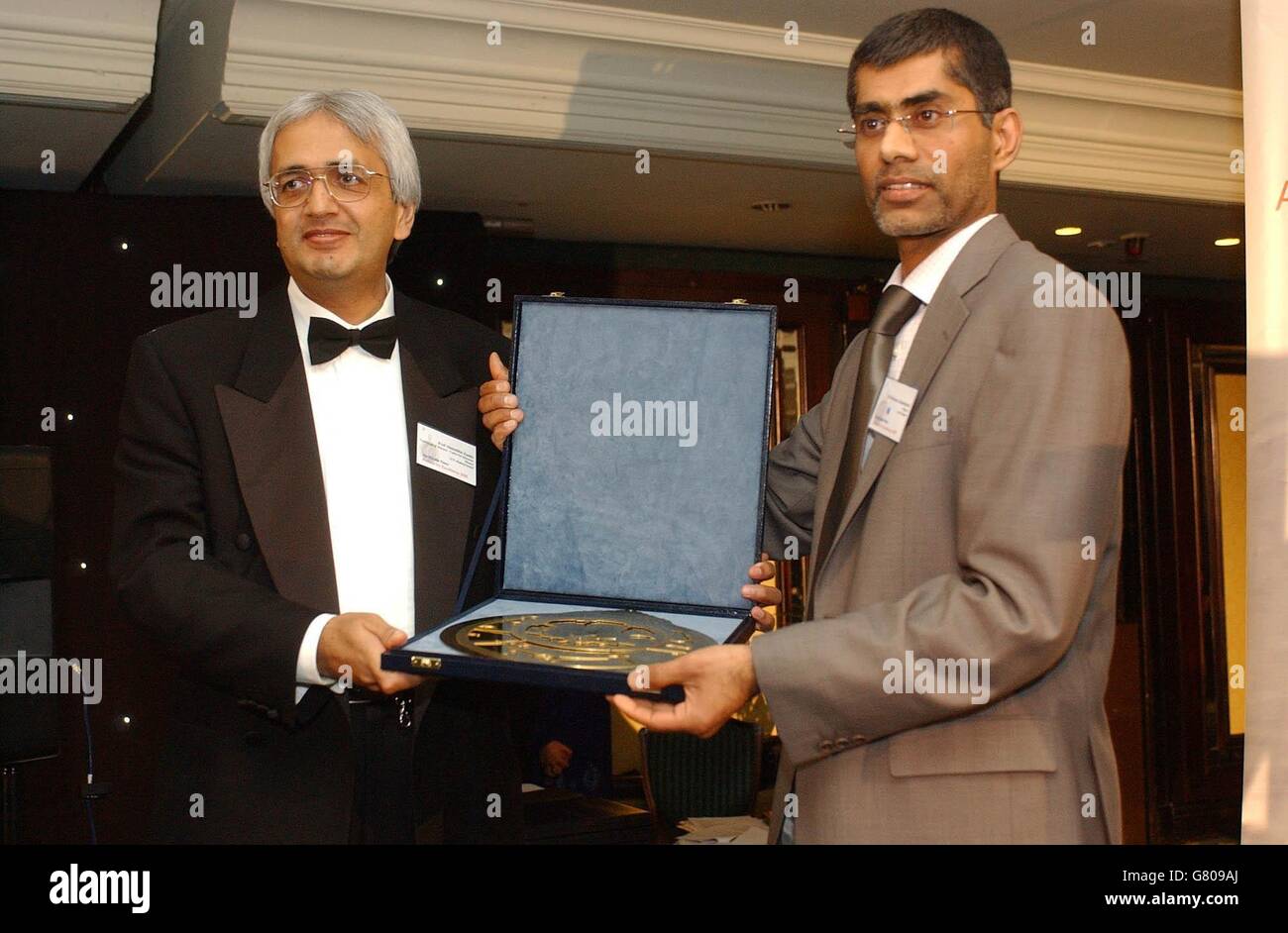 Professor Alimuddin Zumla is presented with the Health Award by Murtaza ...