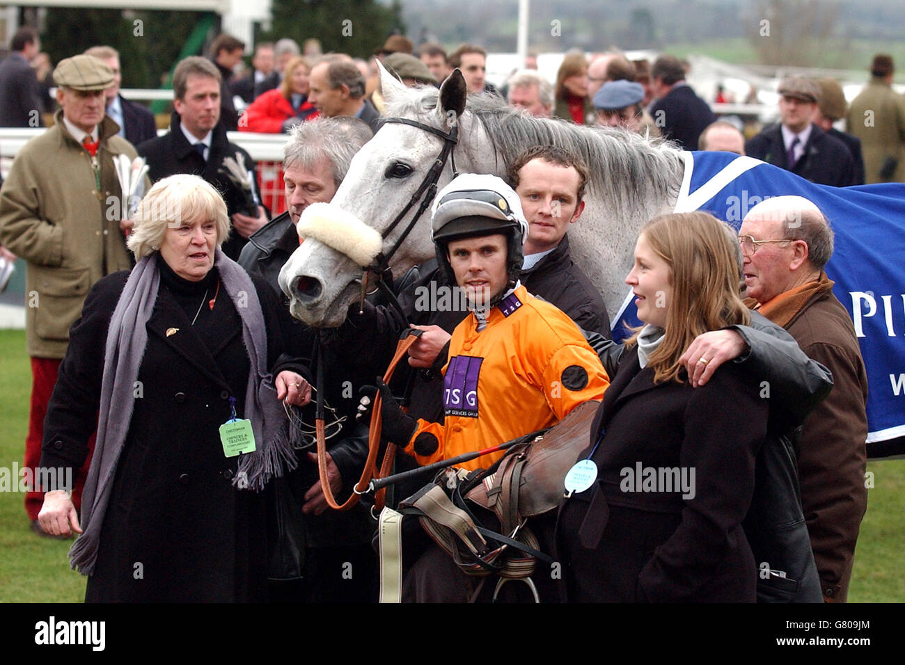 Jockey Graham Lee stands with racehorse Grey Abbey and owners The Roper ...