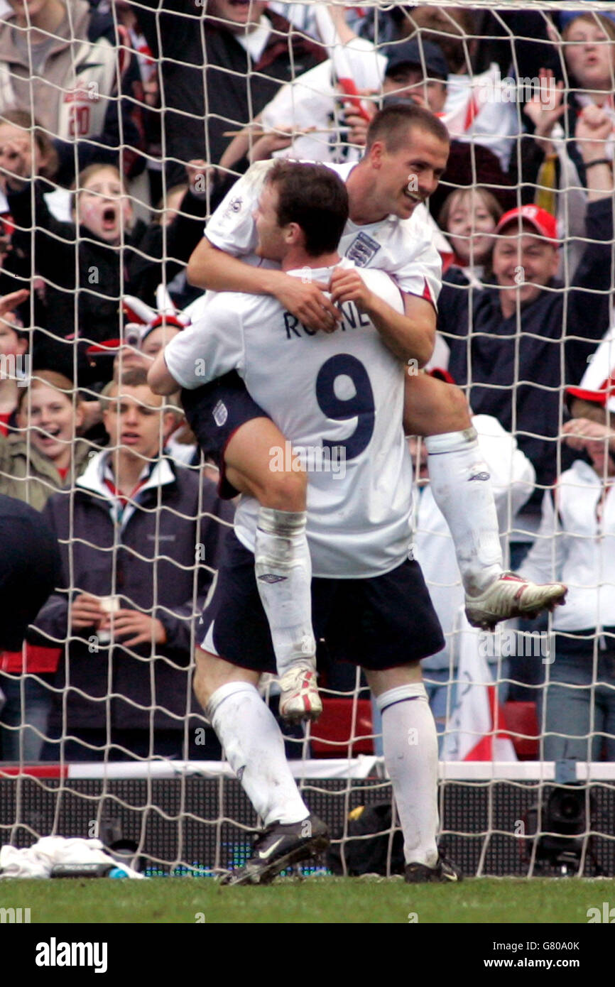 England's Michael Owen celebrates the second goal with Wayne Rooney (an ...