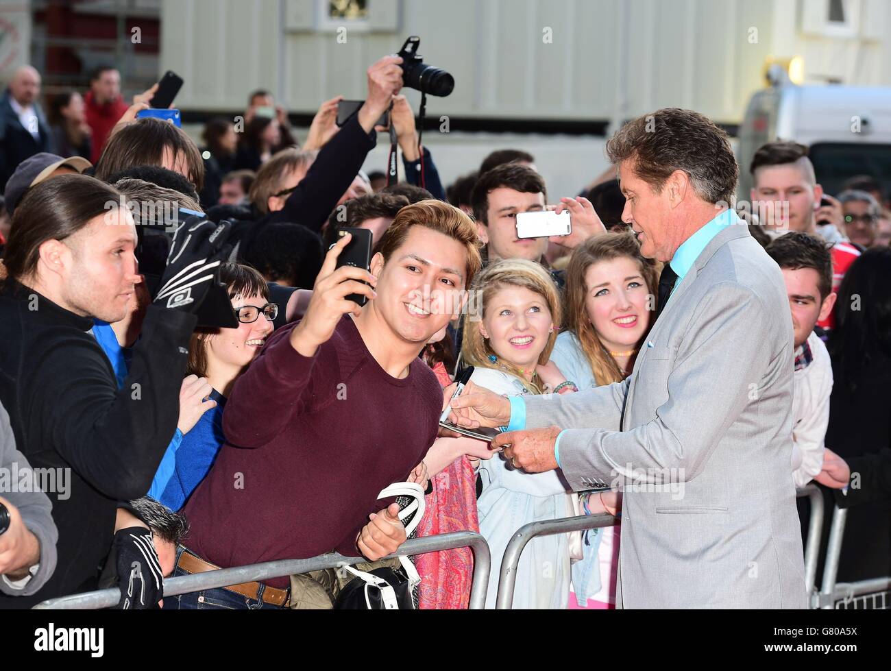 David Hasselhoff has a photo taken with a fan as he attends a press ...