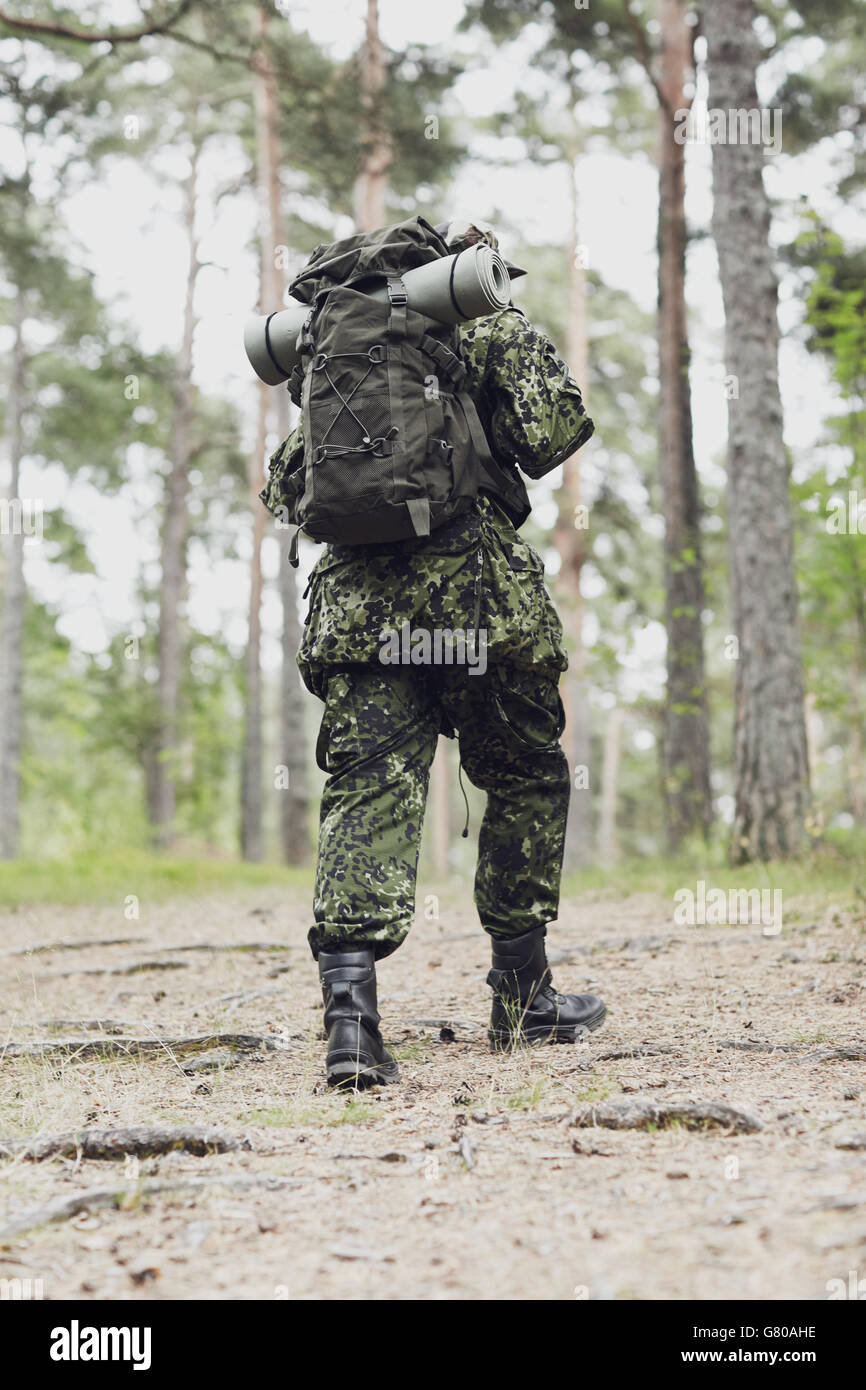 young soldier with backpack in forest Stock Photo - Alamy