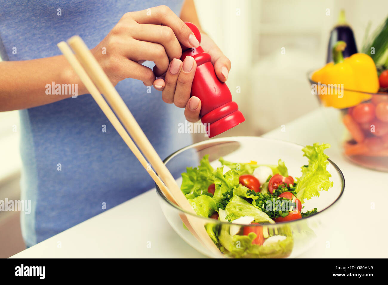 close up of woman cooking vegetable salad at home Stock Photo - Alamy