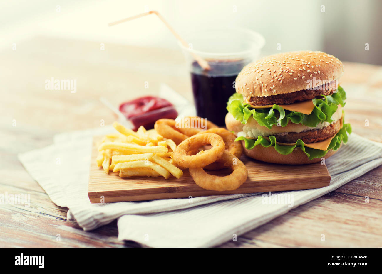 close up of fast food snacks and drink on table Stock Photo - Alamy