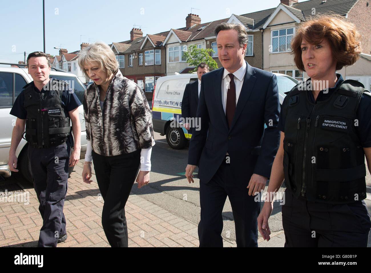 Home Secretary Theresa May (2nd left) and Prime Minister David Cameron ...