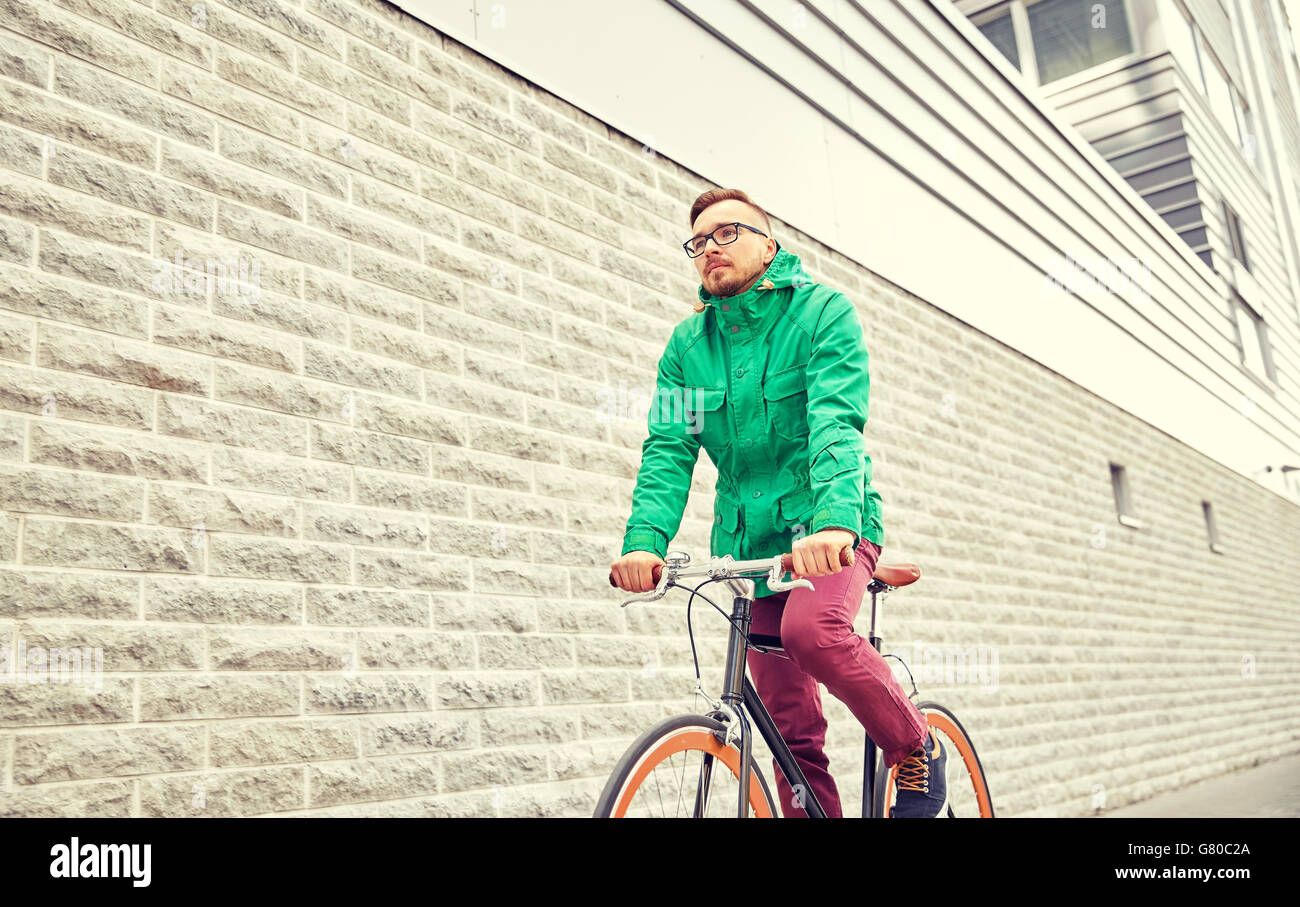 young hipster man riding fixed gear bike Stock Photo - Alamy
