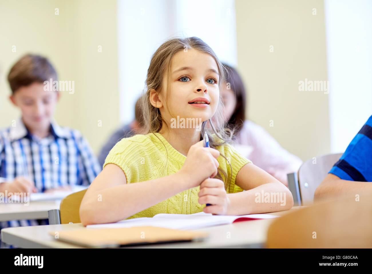 student girl with group of school kids in class Stock Photo - Alamy
