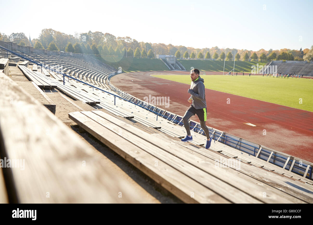 Happy young man running upstairs hi-res stock photography and images ...