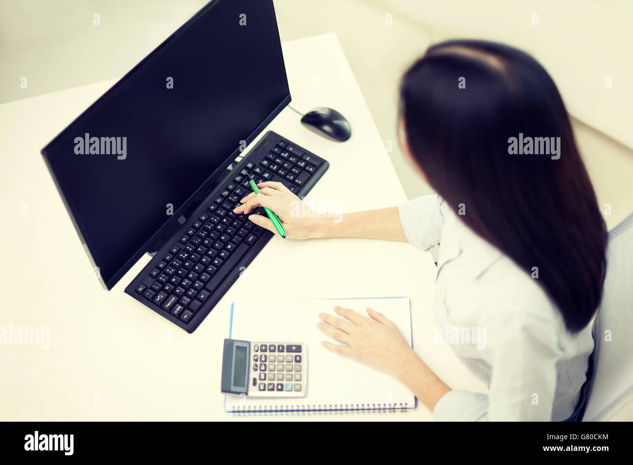close up of woman with calculator counting Stock Photo - Alamy