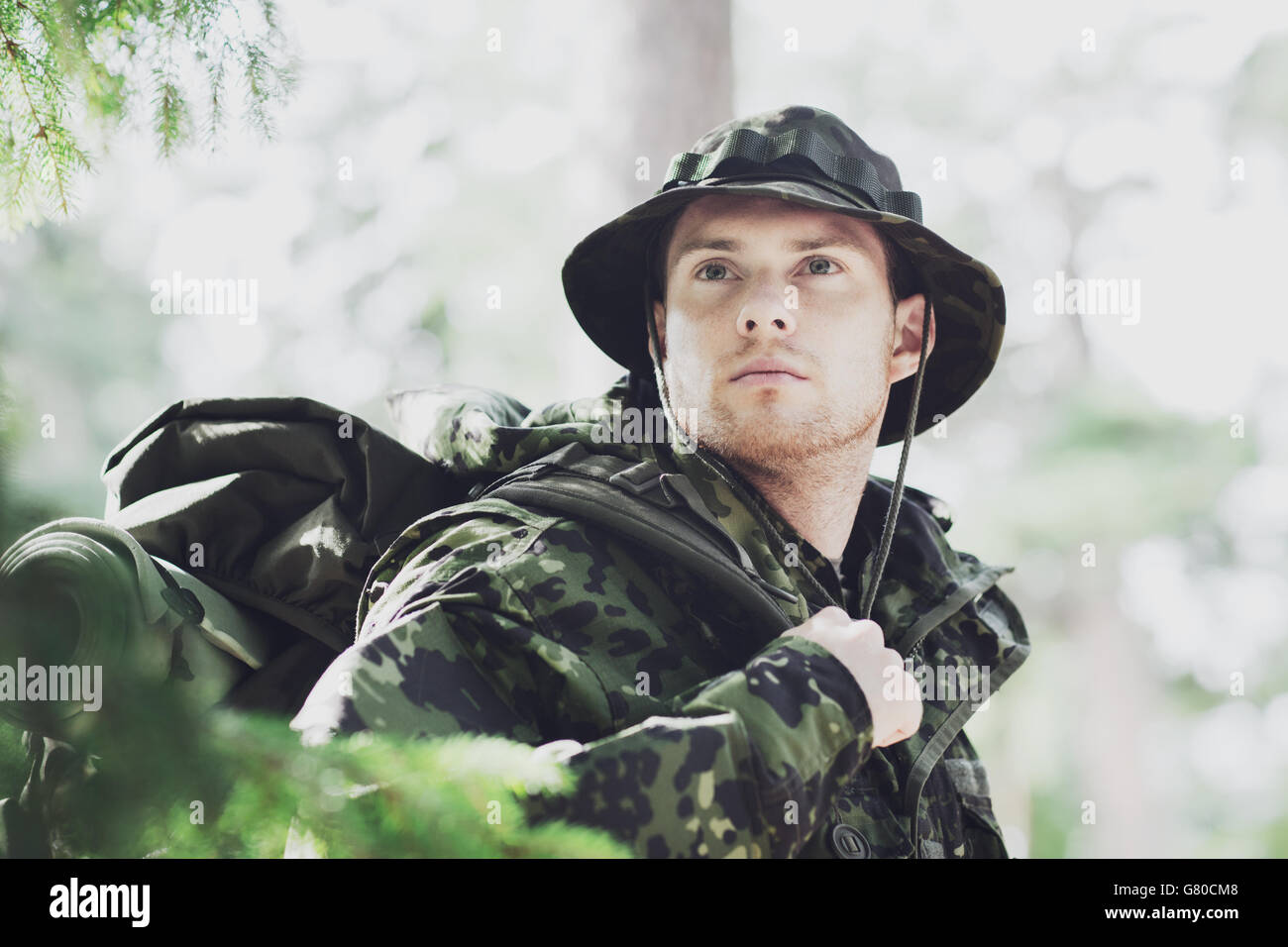 young soldier with backpack in forest Stock Photo - Alamy