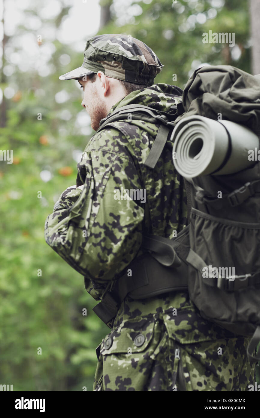 young soldier with backpack in forest Stock Photo - Alamy