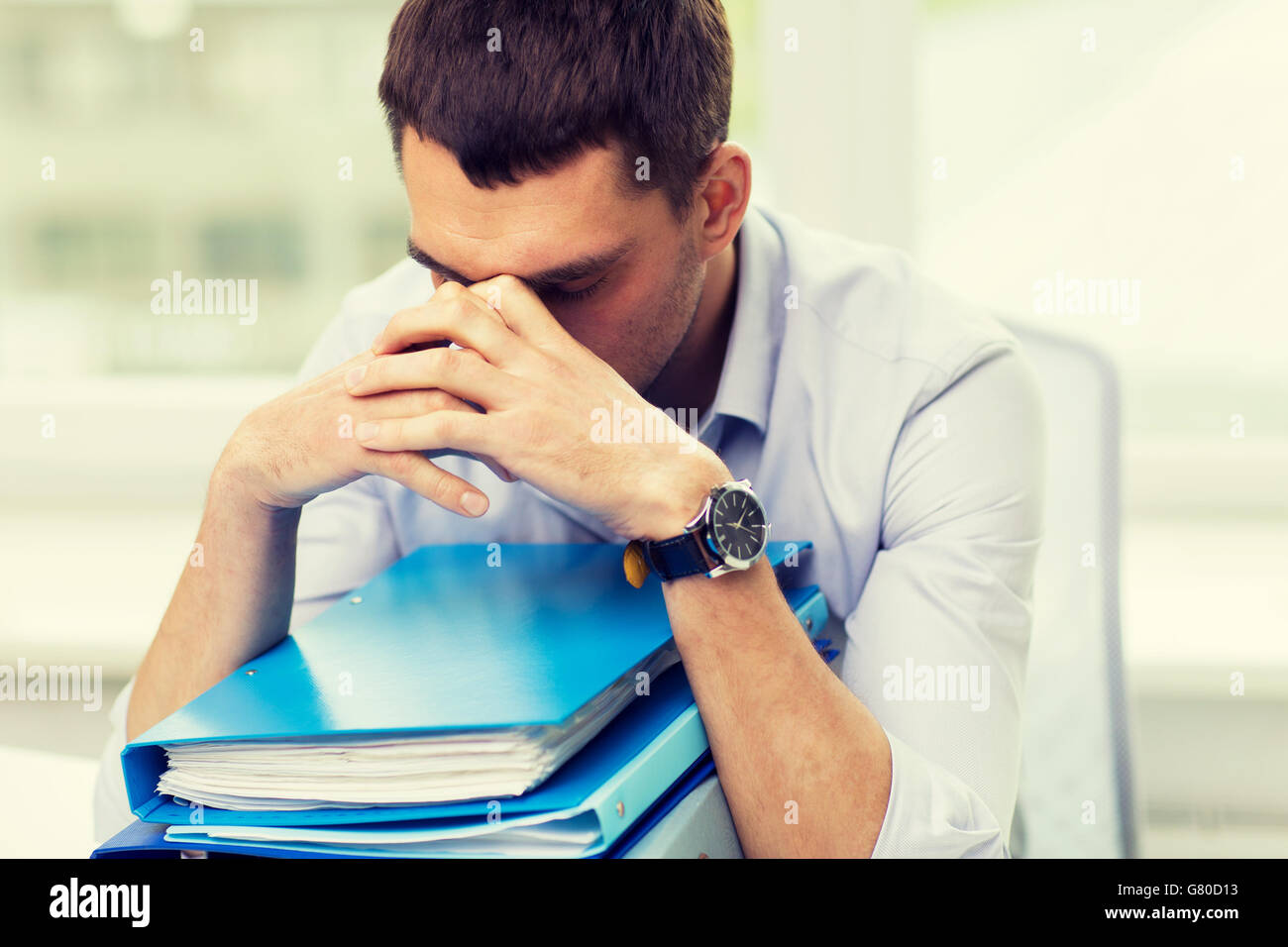 Sad businessman stack folders hi-res stock photography and images - Alamy