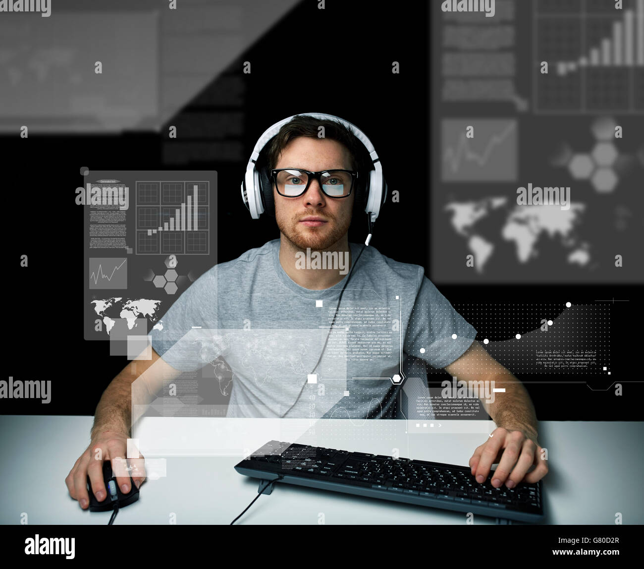 man in headset with computer over virtual screens Stock Photo - Alamy