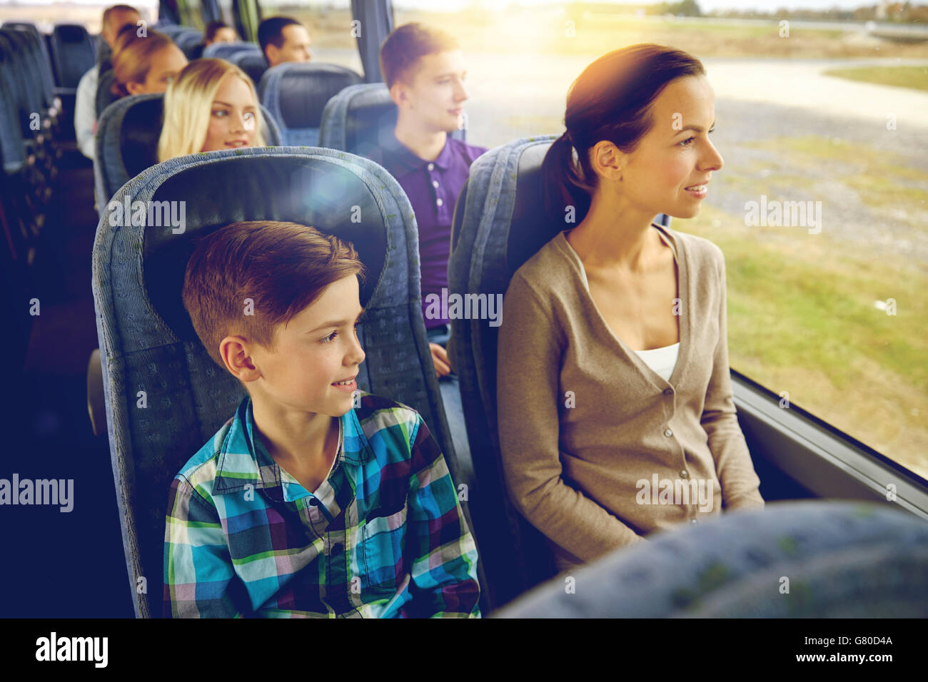 happy family riding in travel bus Stock Photo - Alamy