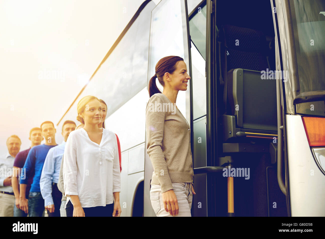 group of happy passengers boarding travel bus Stock Photo - Alamy
