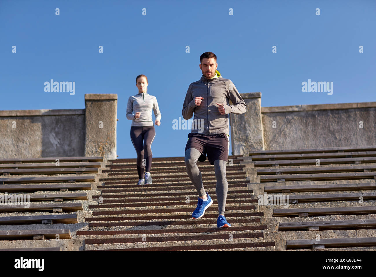 Sporty couple running downstairs hi-res stock photography and images ...