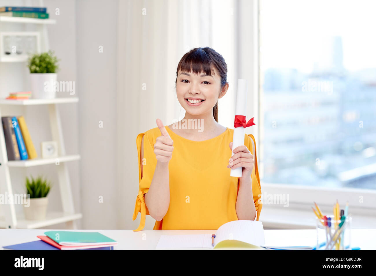 happy asian woman student with diploma at home Stock Photo - Alamy