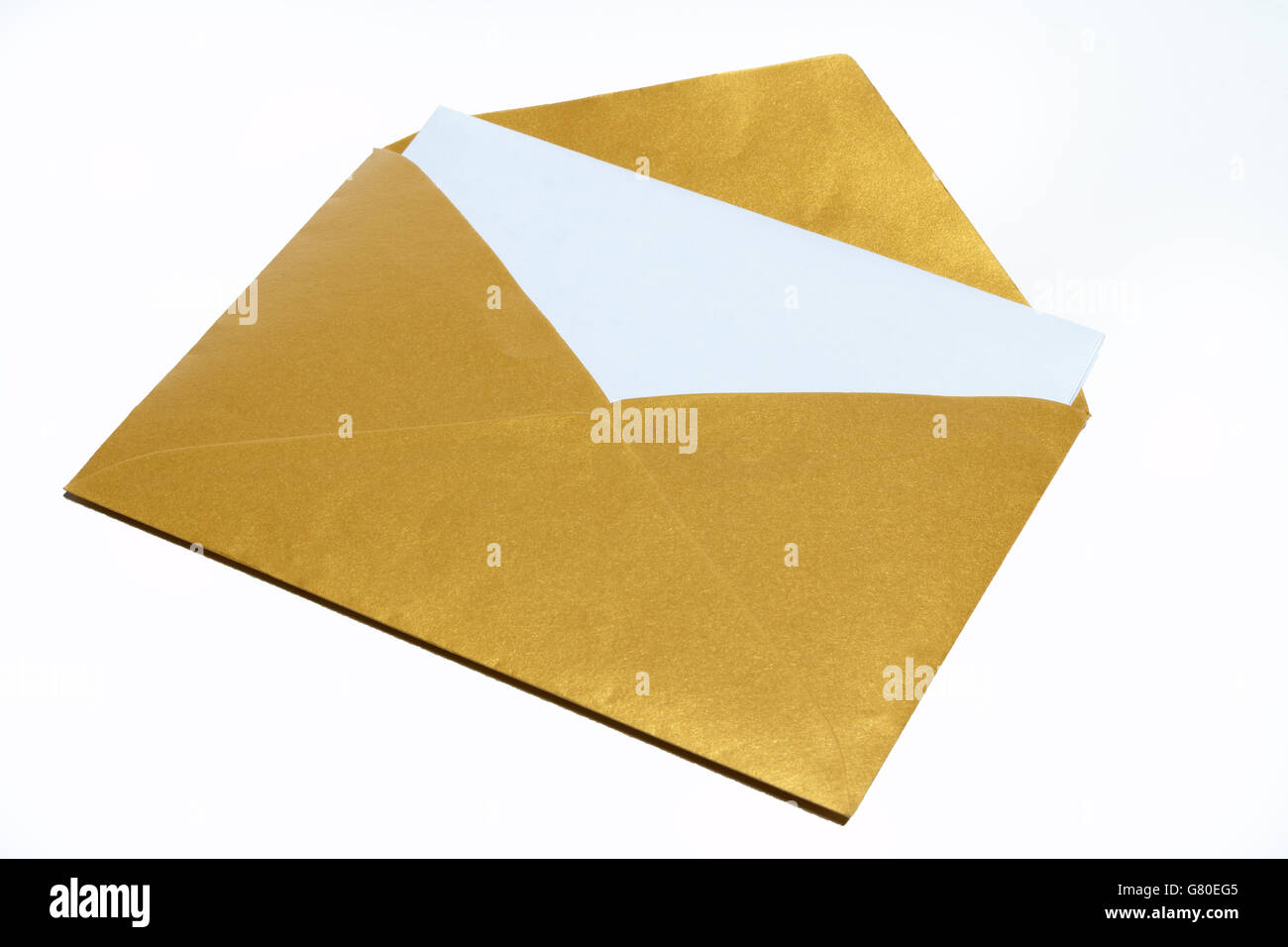 Gold envelope white a white sheet of paper inside isolated on white ...