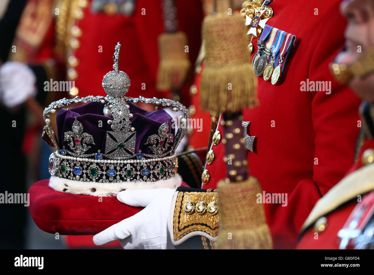 The Imperial State Crown is carried through the Sovereign's Entrance at ...
