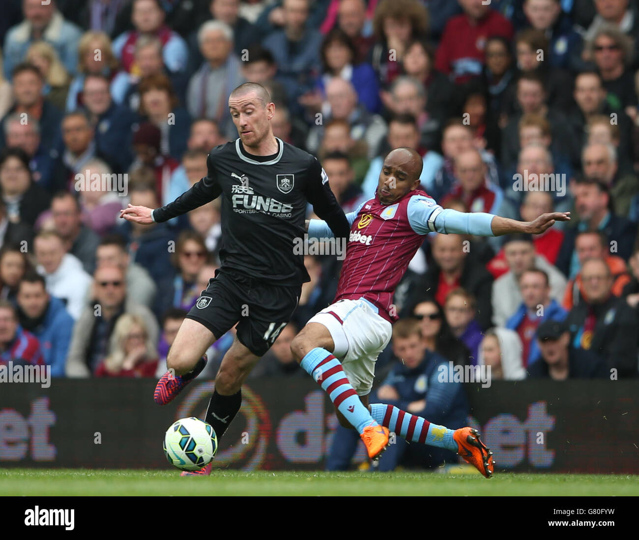 David Jones of Burnley (L) in action with Fabien Delph of Aston Villa ...