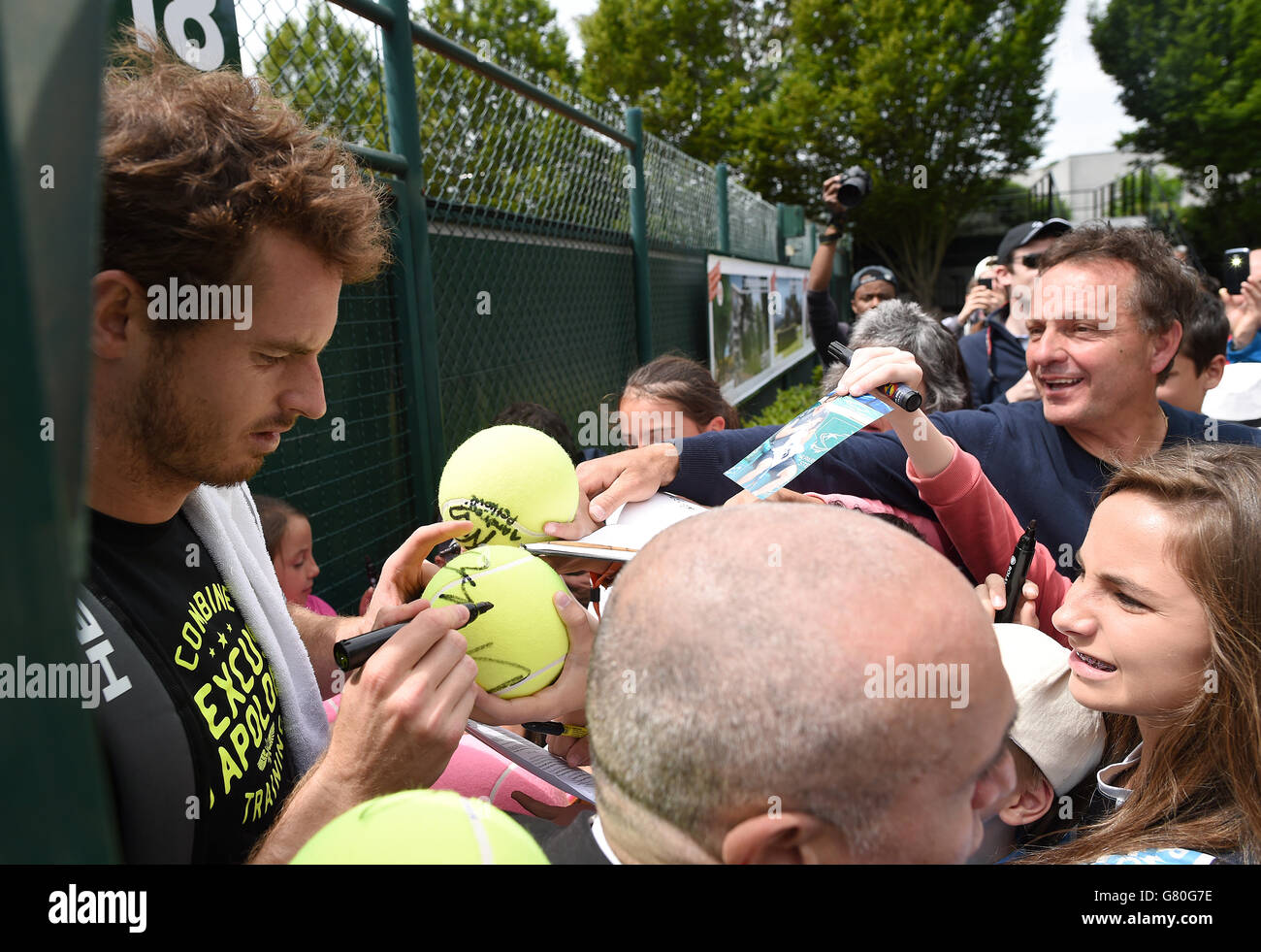 Andy Murray signs autographs for tennis fans on day six of the French ...
