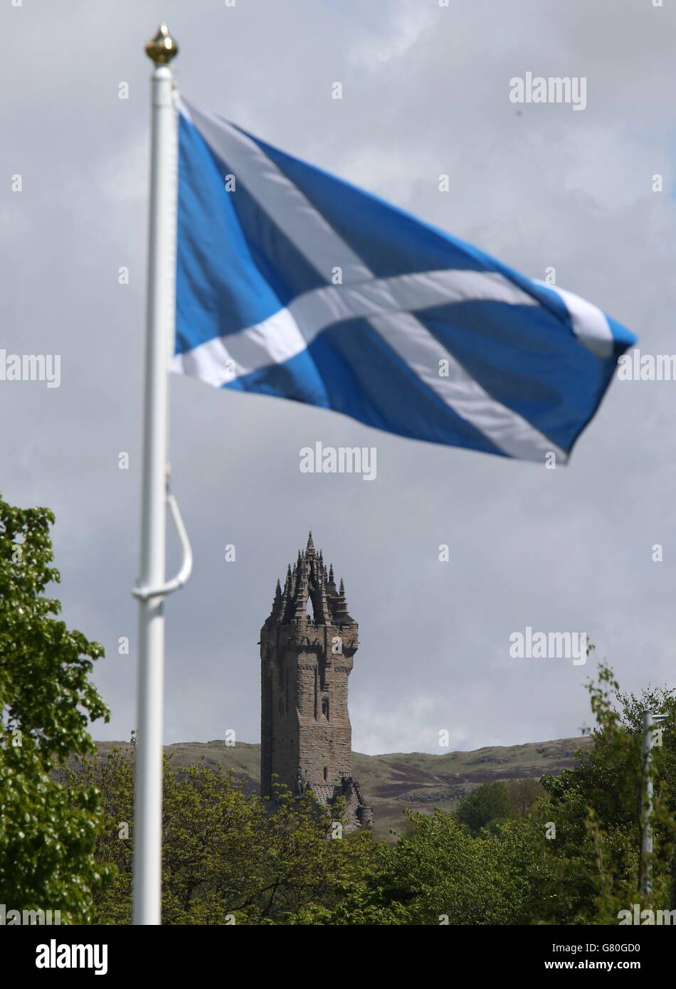 A Saltire flag is raised atop a permanent flagpole in front of the ...