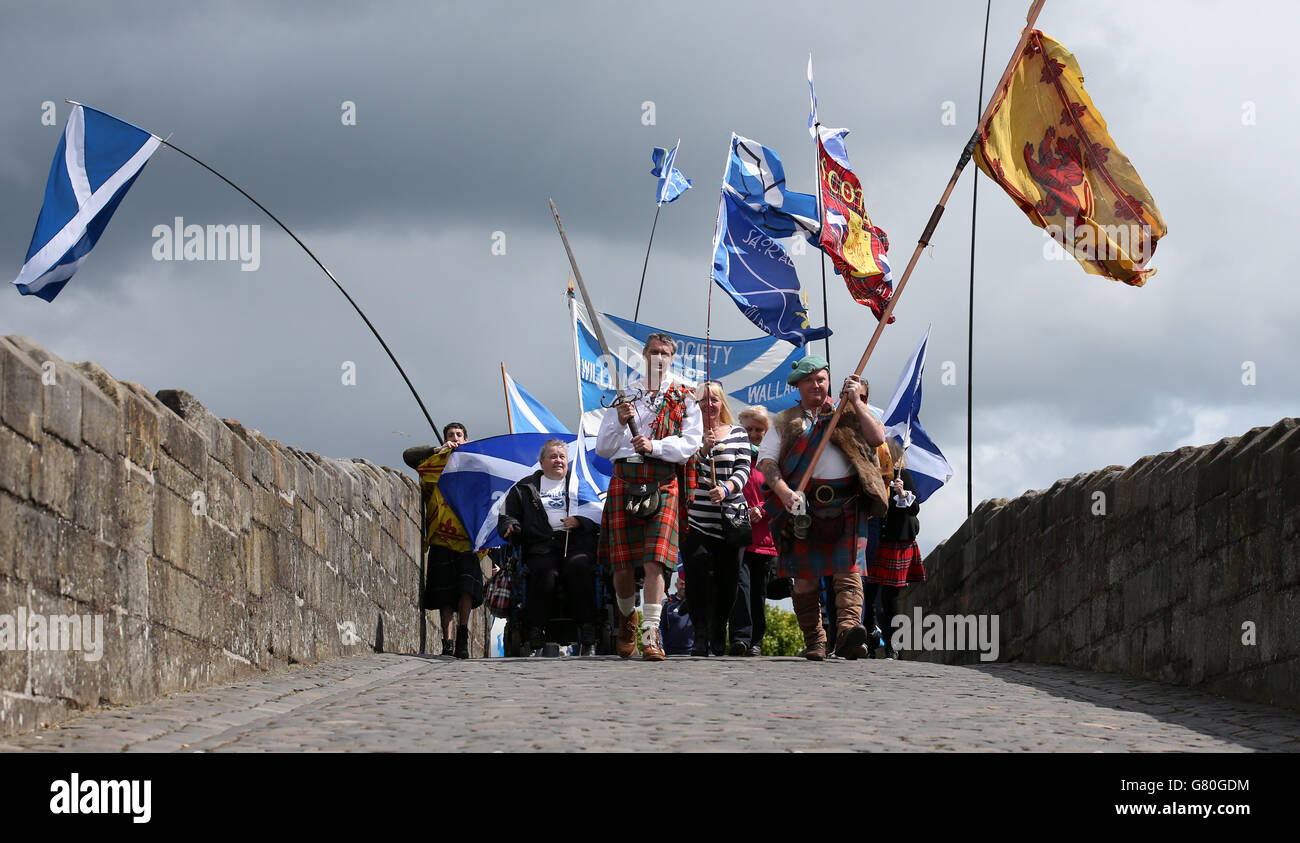 Battle re-enactors and members of the public cross Stirling Bridge ...