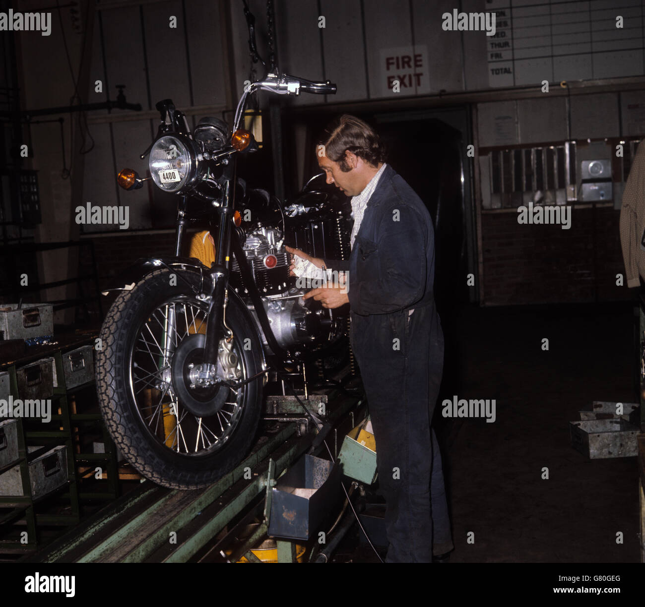 Barry Booth fitting the 750cc engine to a Bonneville motorcycle at ...