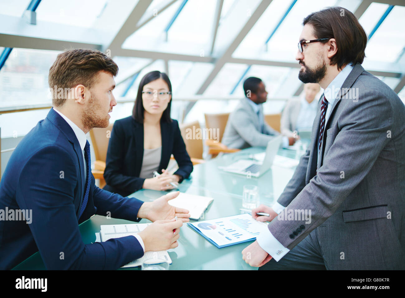 Men talking at conference Stock Photo - Alamy