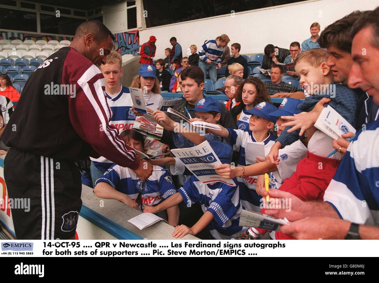 14-OCT-95. QPR v Newcastle. Les Ferdinand signs autographs for both ...