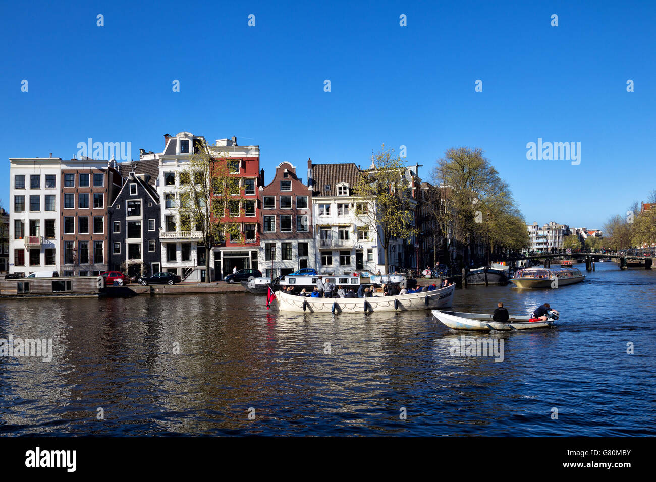 View over the Amstel river in downtown Amsterdam, Netherlands in spring ...
