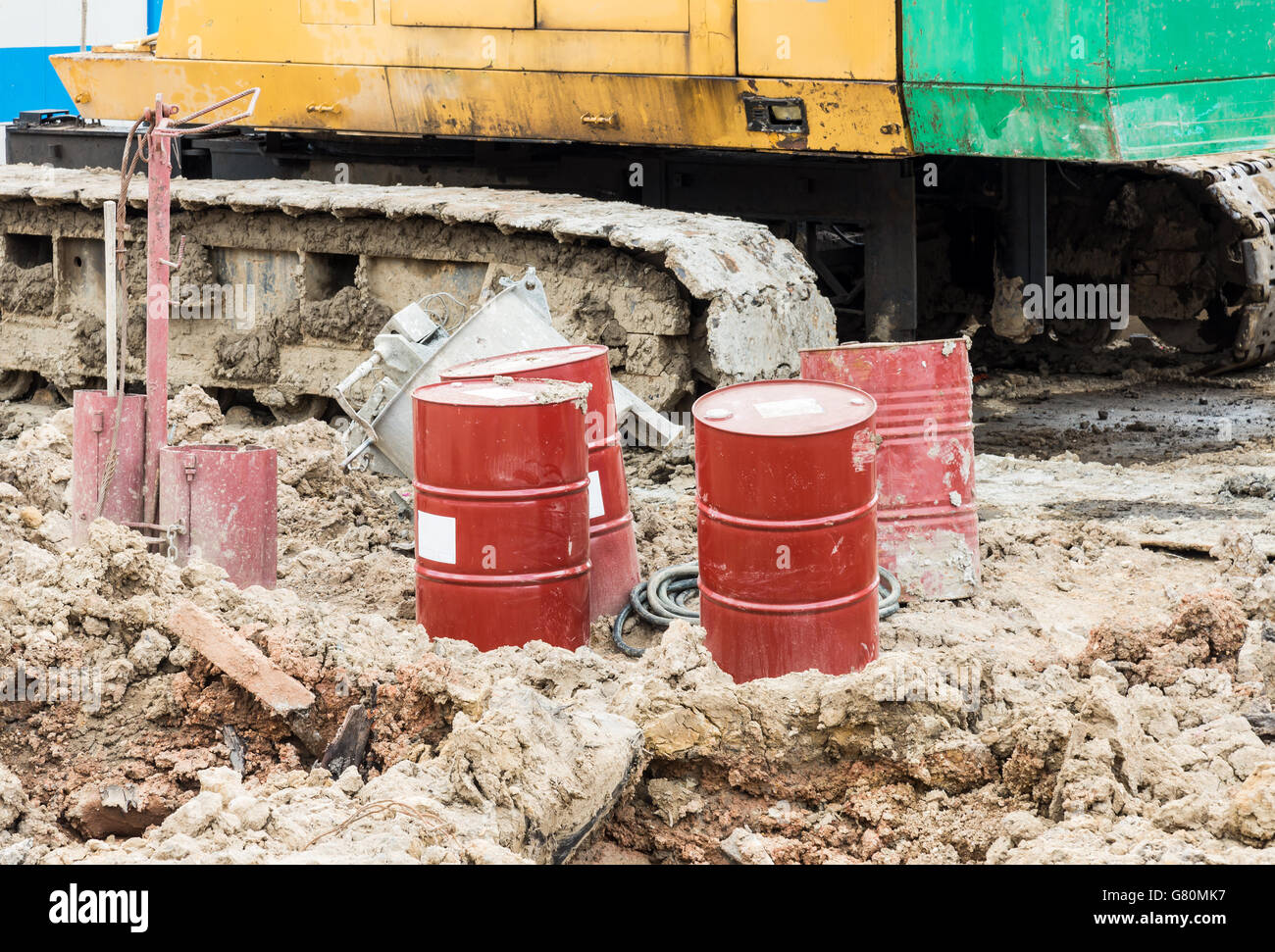 Metal oil tank near the old loaders in the construction site Stock ...