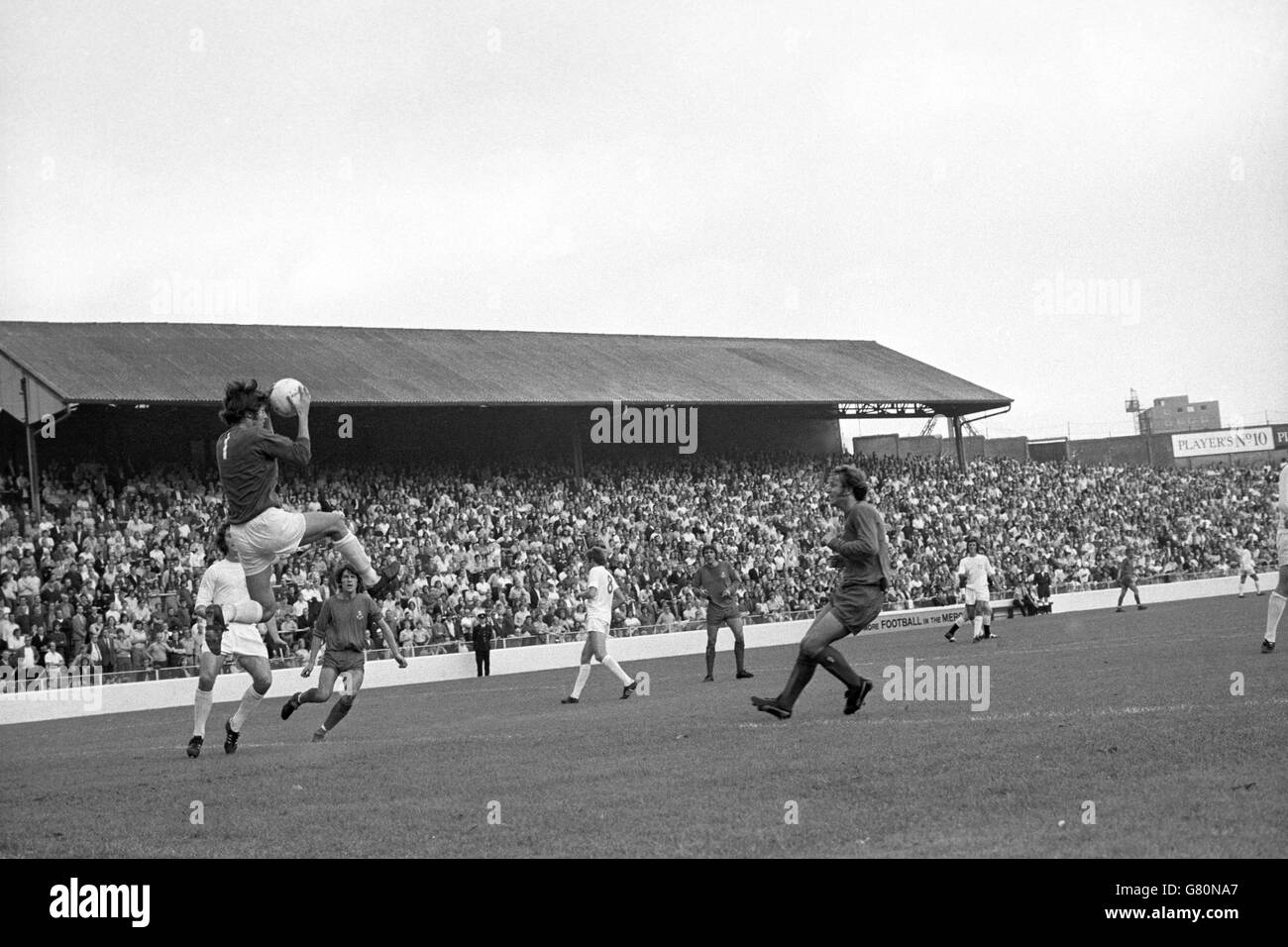 Millwall goalkeeper Bryan King jumps up to save the ball during a ...