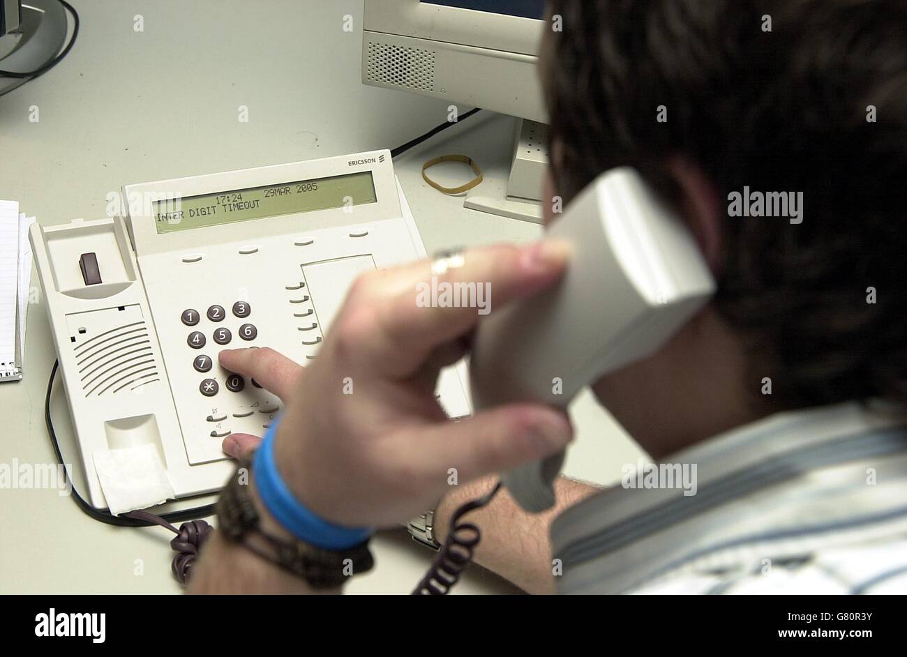 Using the Telephone in the Workplace Stock Photo - Alamy