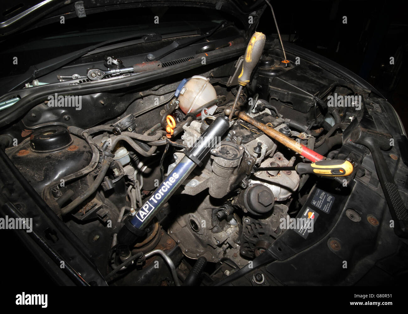 Working on a car engine in a garage workshop Stock Photo - Alamy
