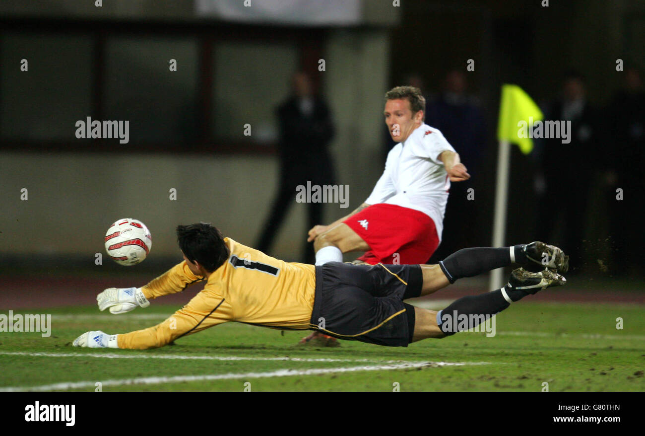 Austria's goalkeeper Helge Payer saves at the feet of Wales' Craig ...