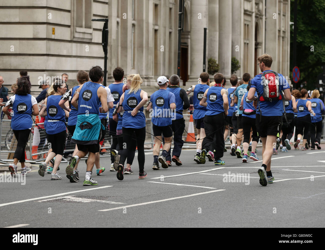 Athletics - Bupa London 10,000 - London. A group of runners tethered to ...
