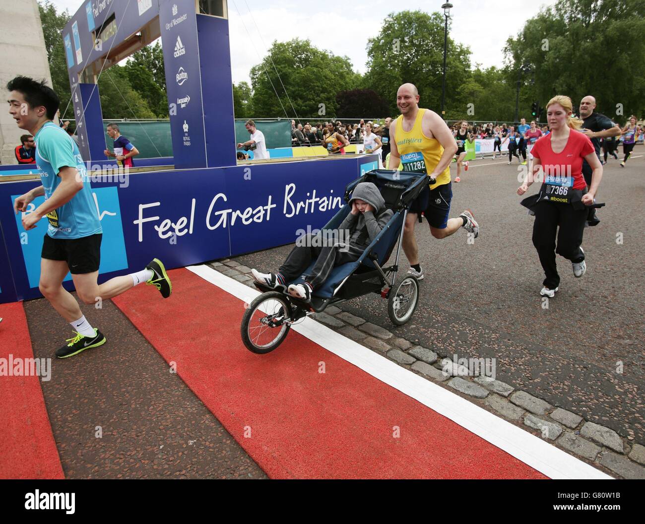 Runners crossing the finish line during the Bupa London 10,000, in ...
