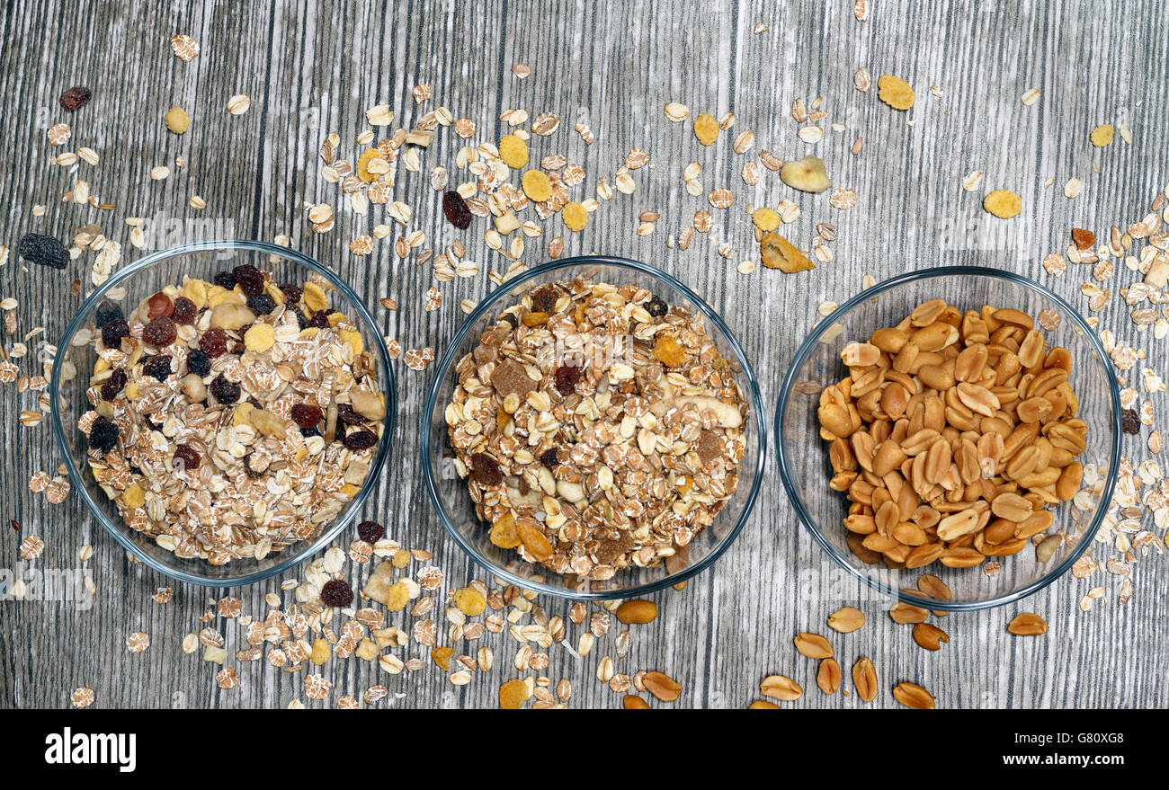 Healthy cereals for breakfast on white plate and glass bowl on a ...