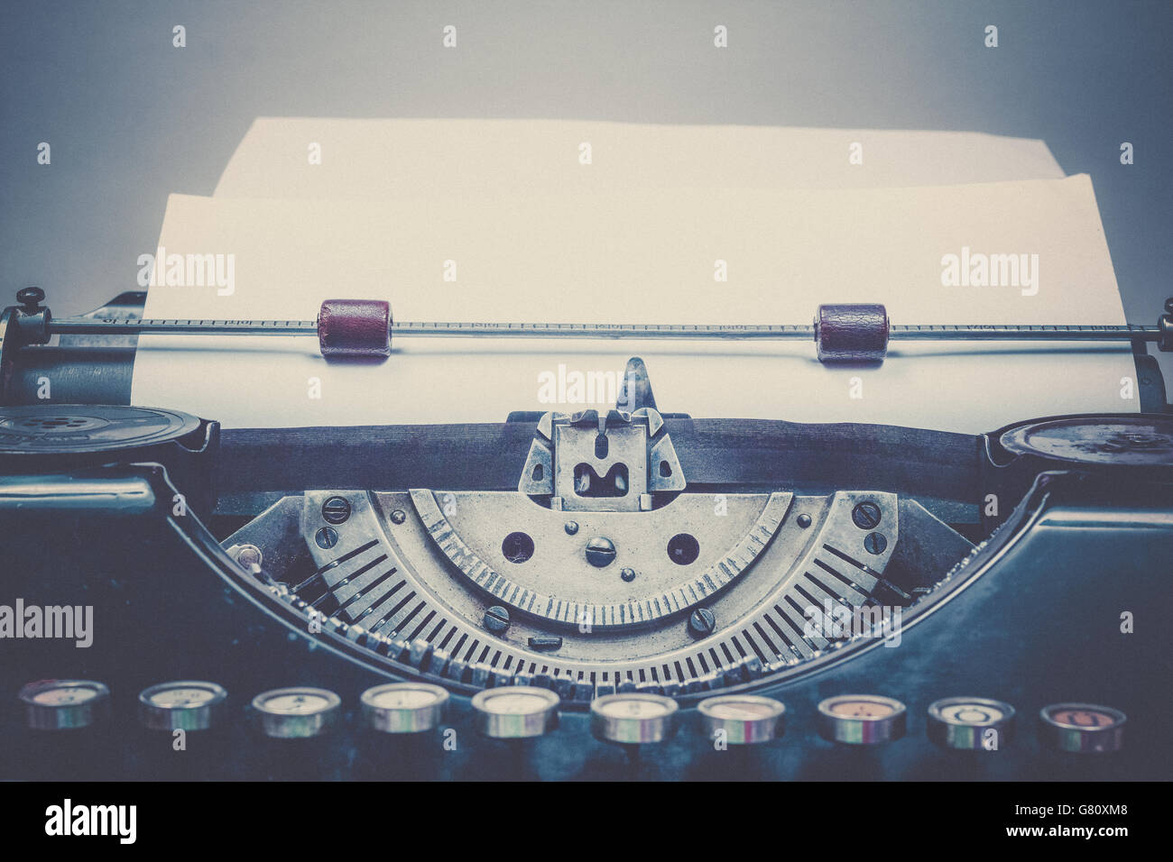 Old typewriter on a textured grey background Stock Photo - Alamy