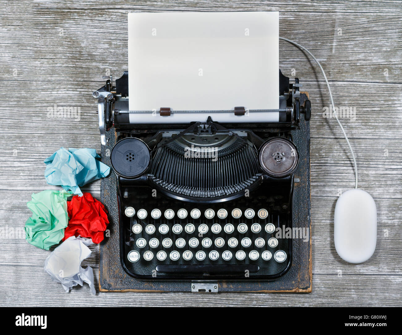 Old typewriter on a textured grey background along with a bunch of ...