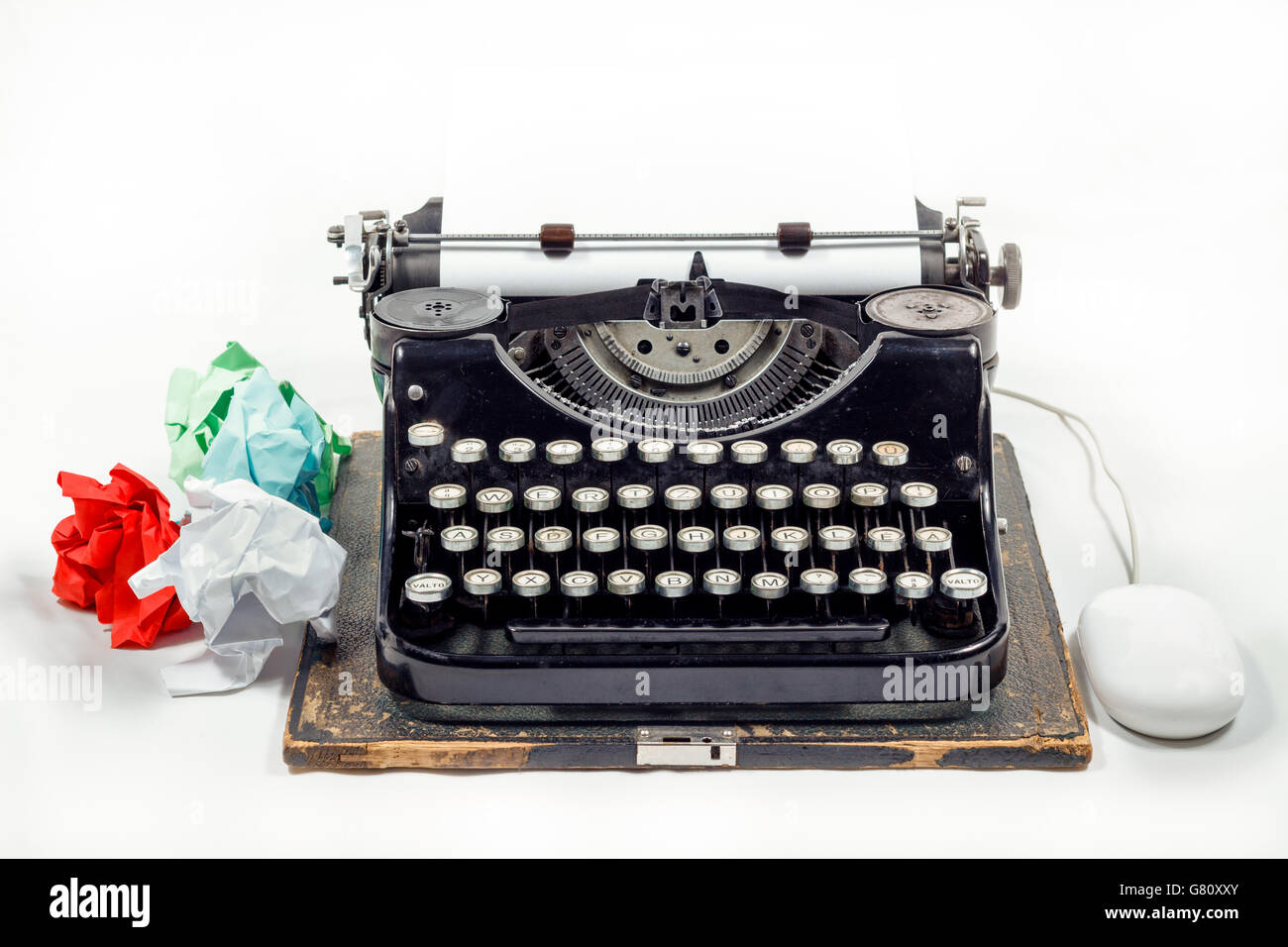 Old typewriter on a textured grey background along with a bunch of ...
