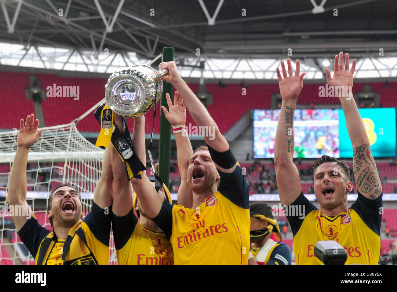 Arsenal's Per Mertesacker (second Right) and Olivier Giroud (right ...