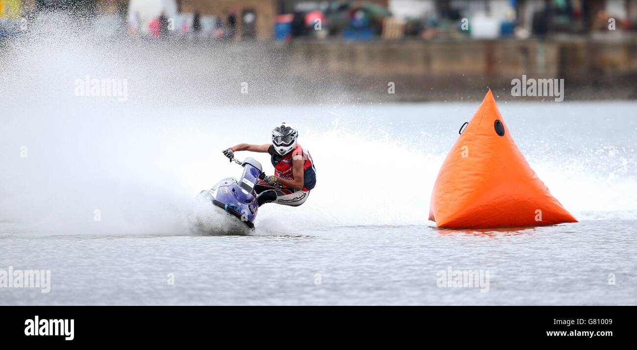 A competitor takes part in the jet ski AquaX race in the South Bay ...