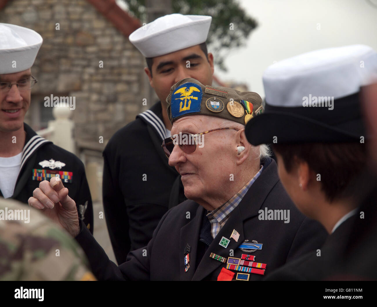 A gathering of veterans, serving soldiers and local dignitaries in ...