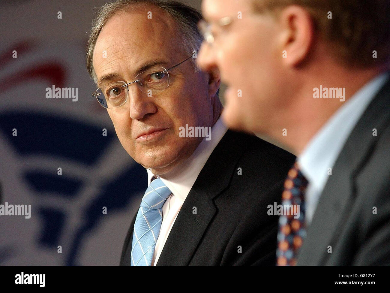Conservative party leader michael left listens as colleague david ...