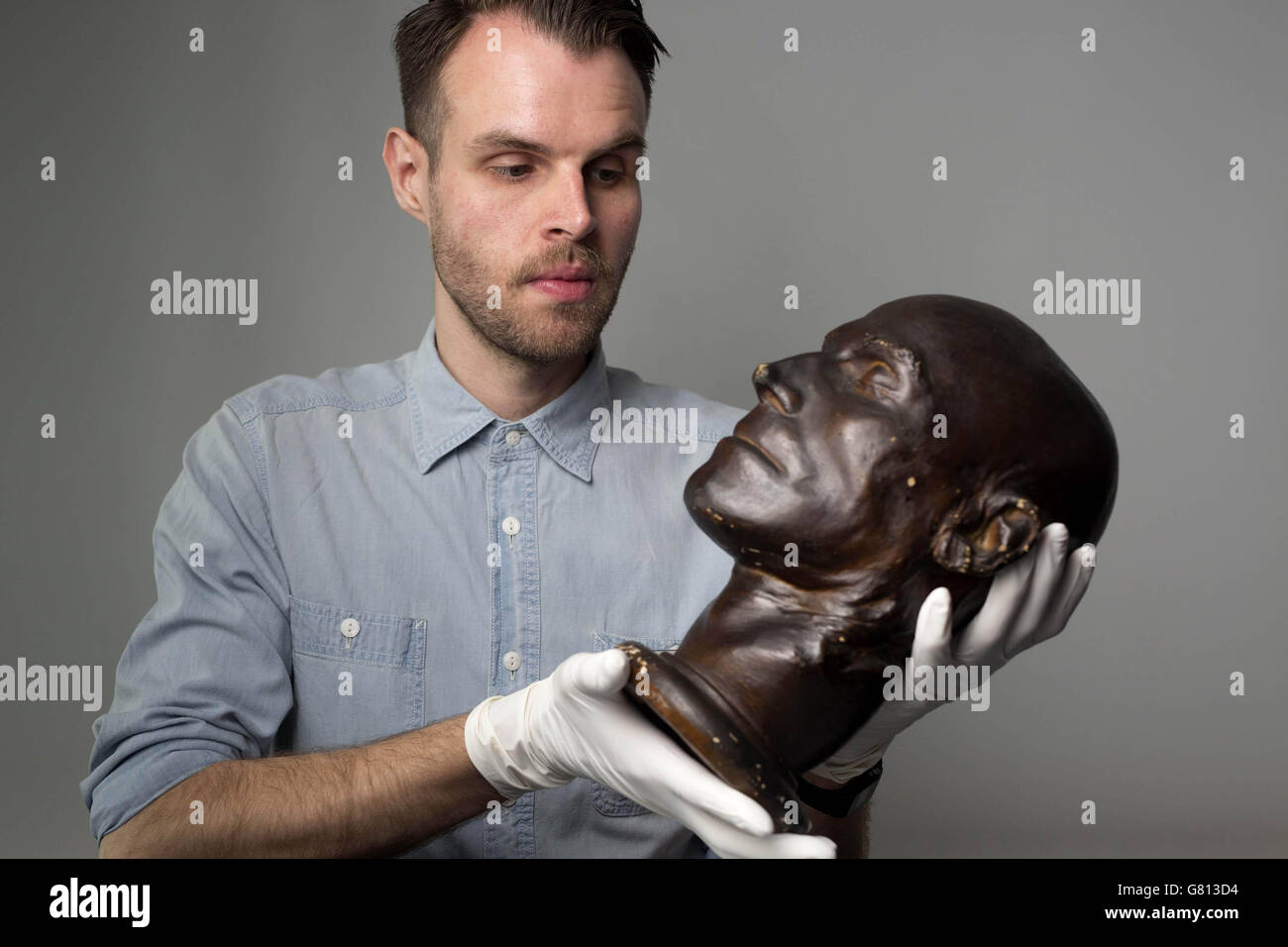 EDITORIAL USE ONLY Conservator John Readman prepares the Death mask of ...