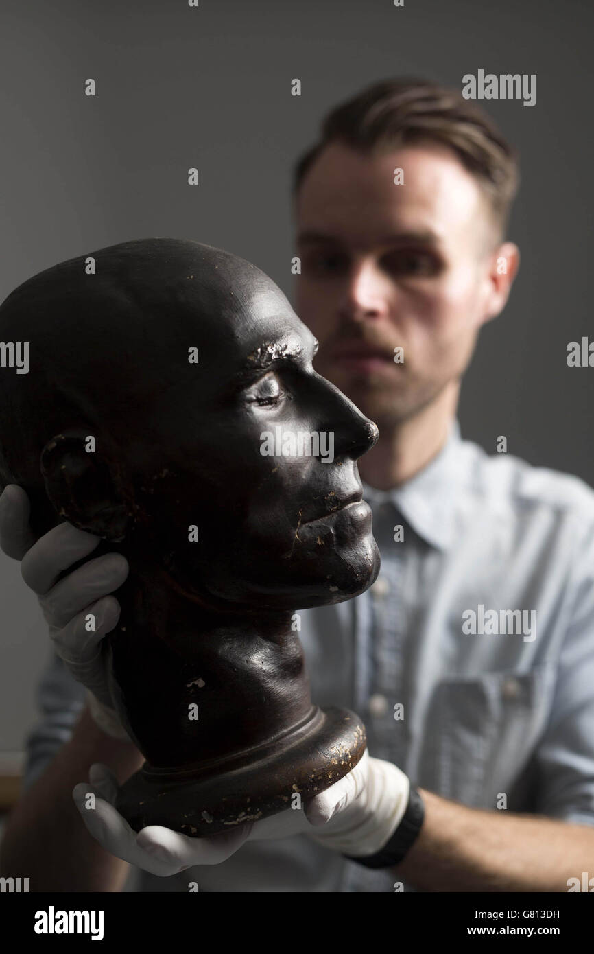 EDITORIAL USE ONLY Conservator John Readman prepares the Death mask of ...